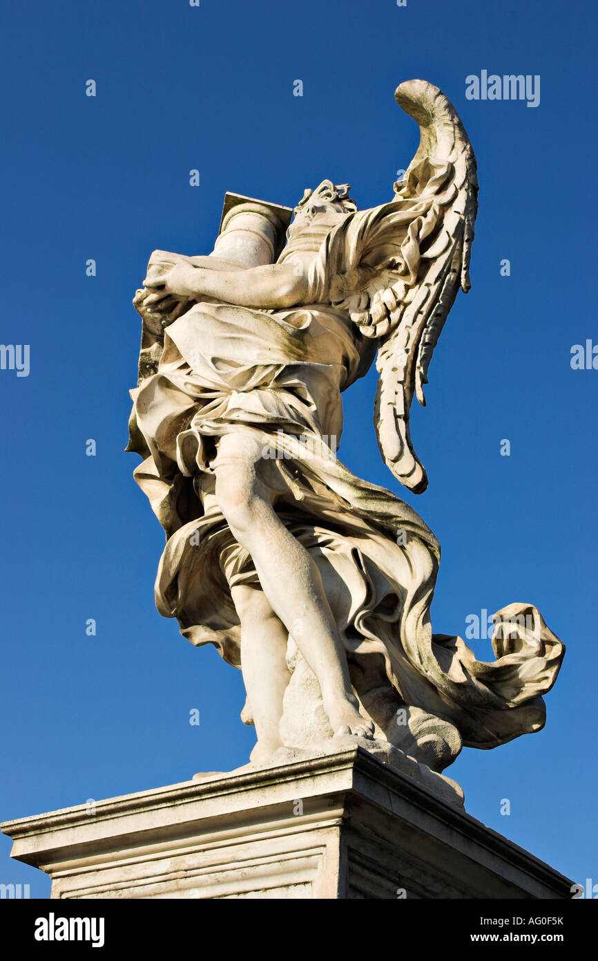 Roman Angel A white marble statue of a winged angel against a deep blue ...