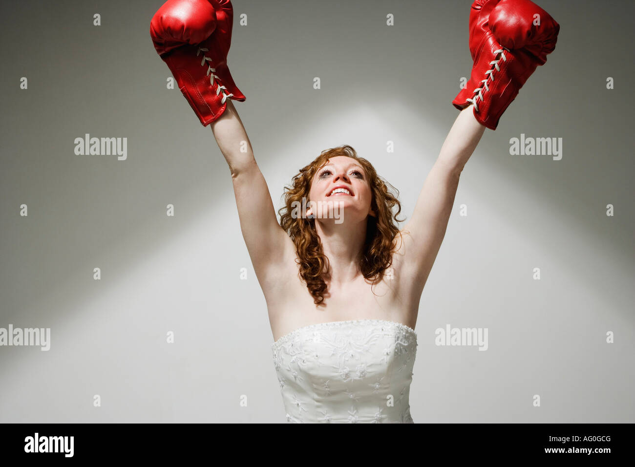 Bride cheering in boxing gloves Stock Photo - Alamy