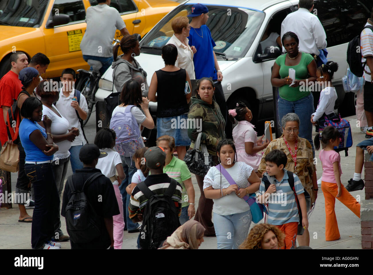 Parents and guardians pick up their children after school Stock Photo ...