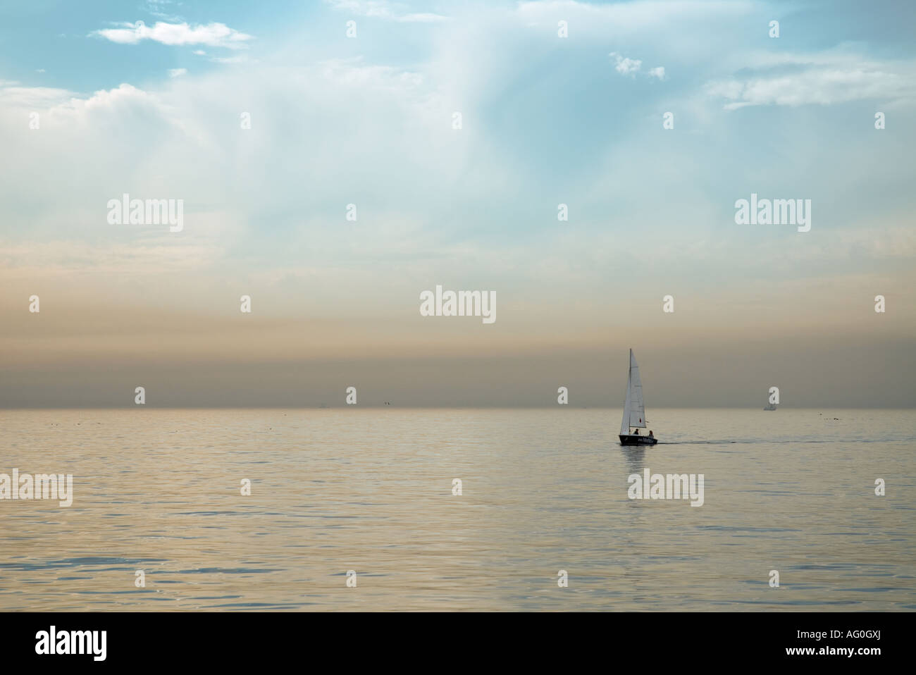 Sailboat at sea in the morning Stock Photo - Alamy