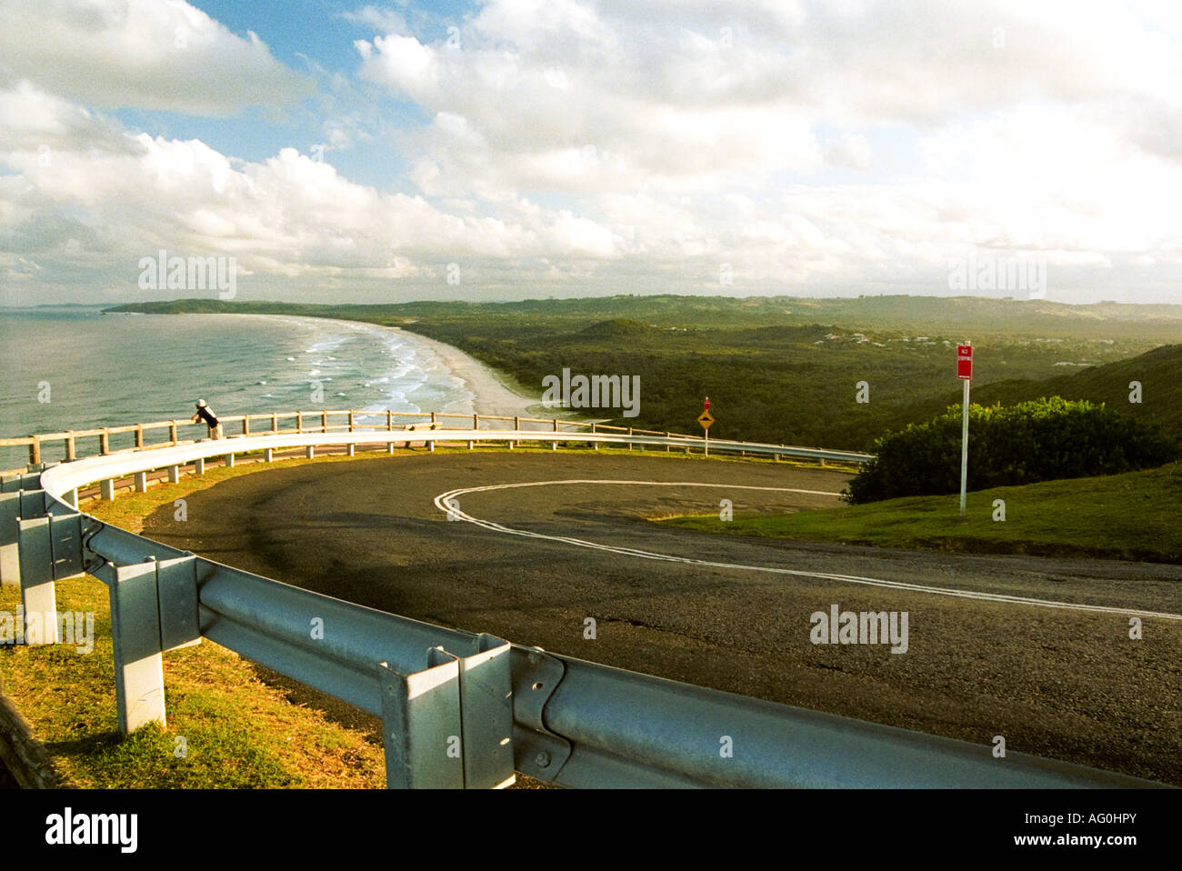 Curving road in the afternoon sun, Byron Bay lighthouse access road ...