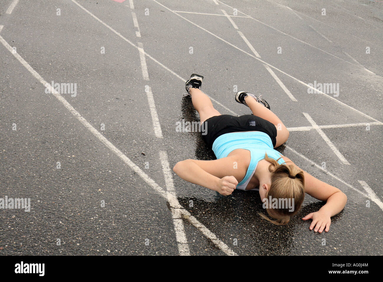 Track Runner Collapsing After Defeat in Competition Stock Photo - Alamy
