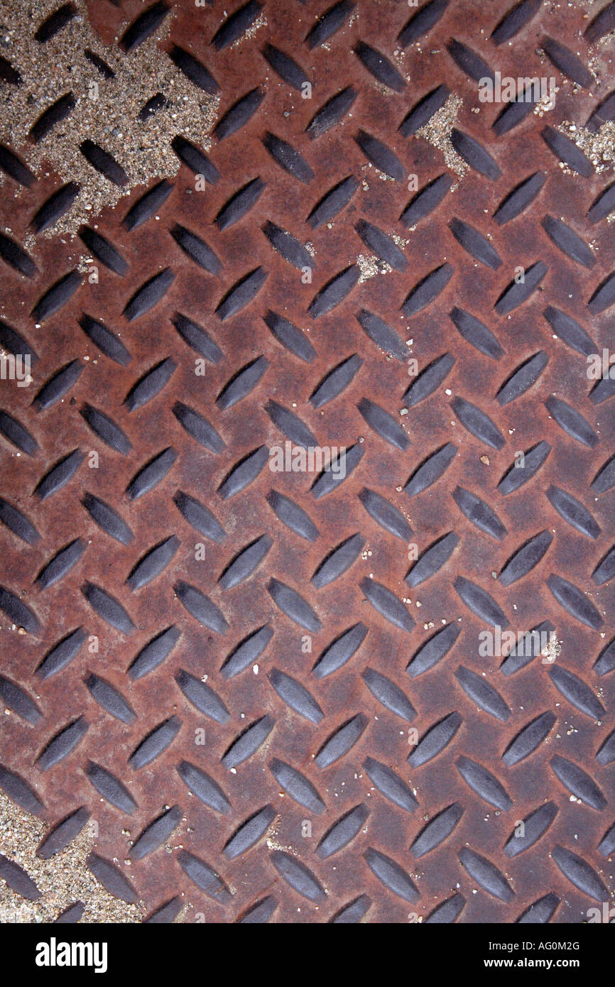 Rusty red steel tread with a little patches of sand Stock Photo - Alamy