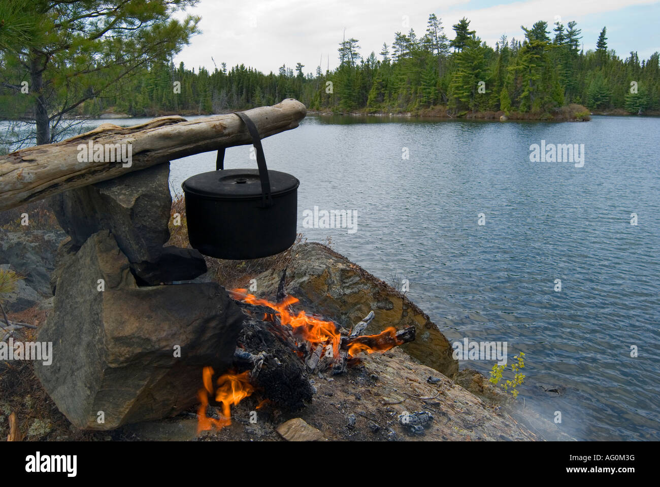 Cooking supper over a campfire Stock Photo - Alamy