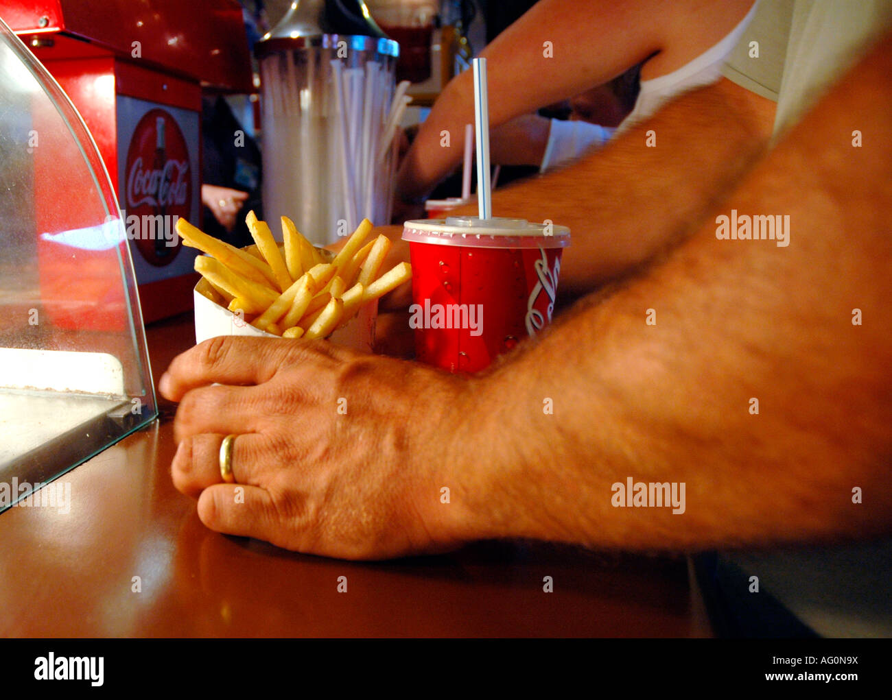 Man Ordering a Portion of Chips and Coke Stock Photo - Alamy