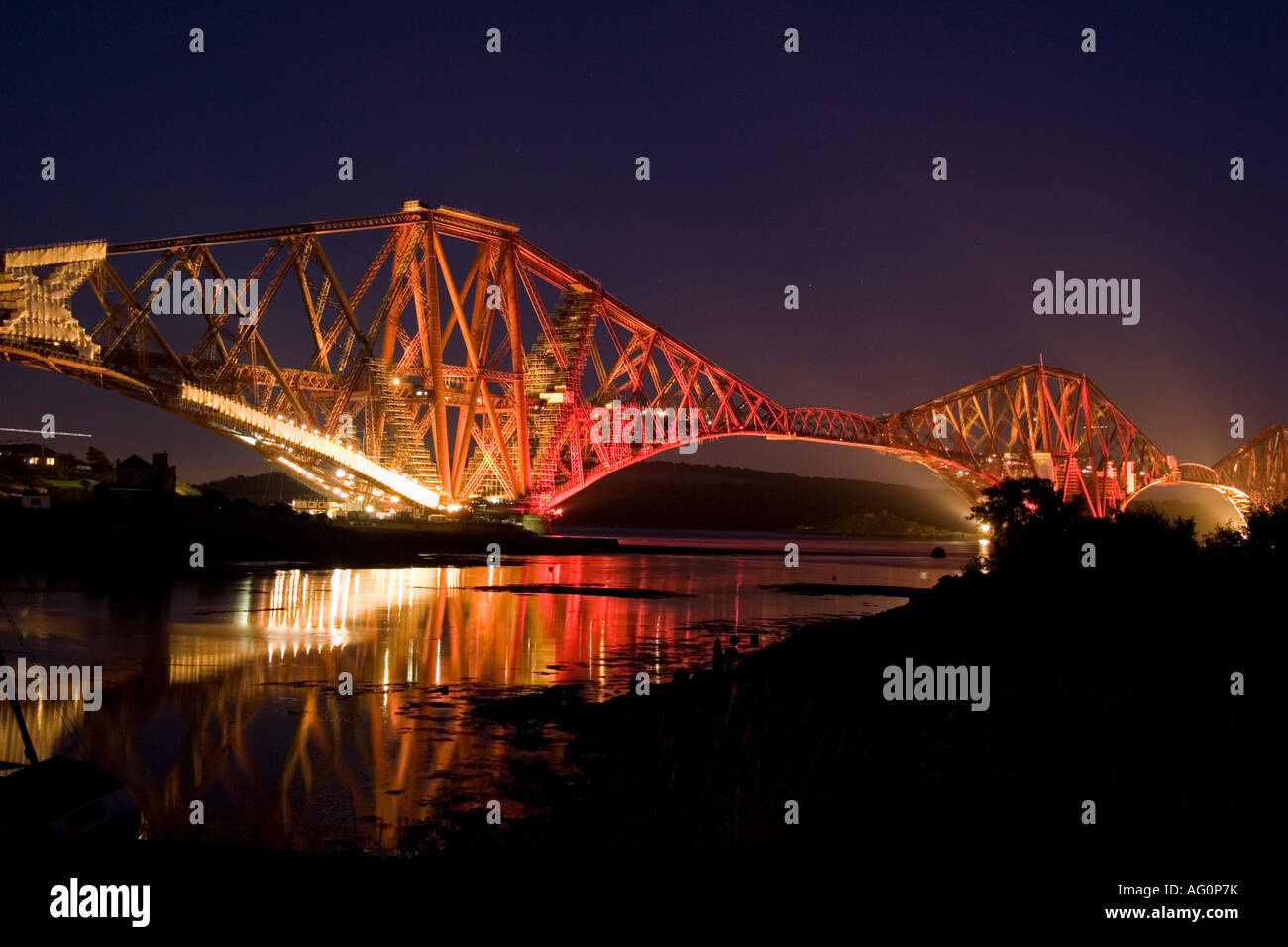 Forth Rail bridge at night lit up with red floodlighting Stock Photo ...
