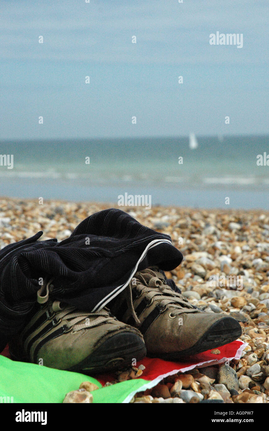 Shoes on the beach Stock Photo - Alamy