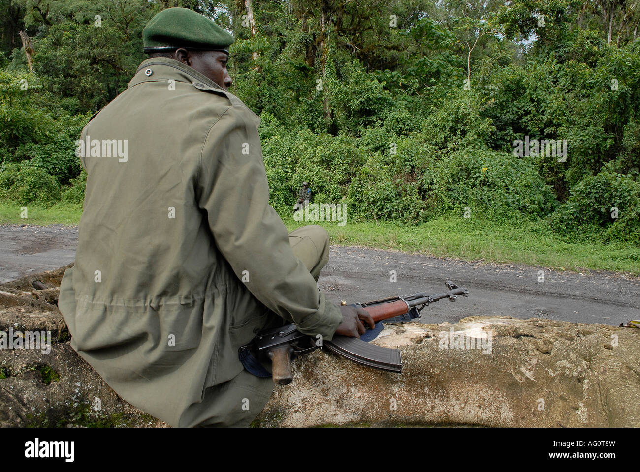 A FARDC Congolese government soldier stands guard with a Kalashnikov AK ...