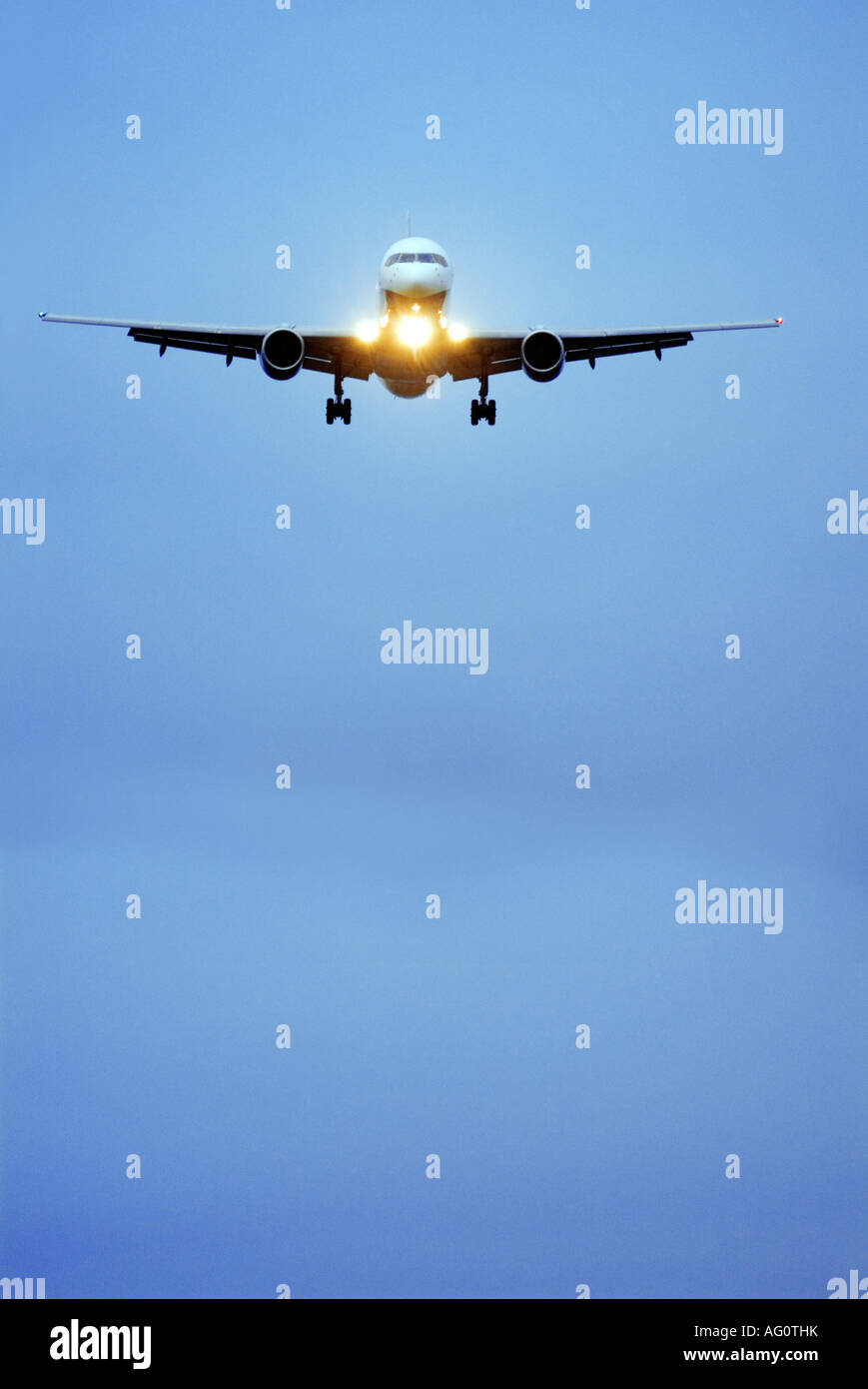 Airliner on final approach with ILS lights on Stock Photo - Alamy