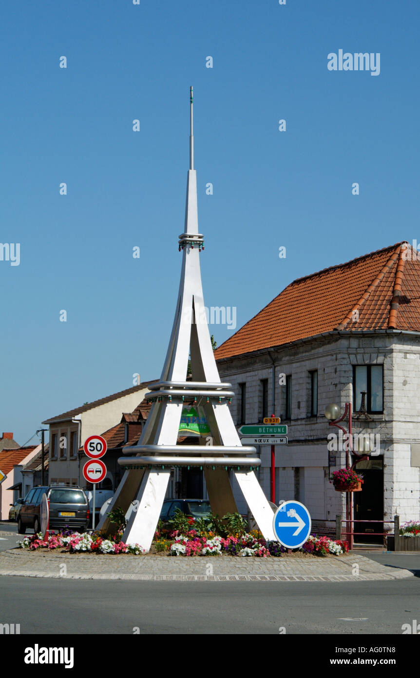 Downsized Eiffel Tower. On a roundabout at Saire northern France Europe ...