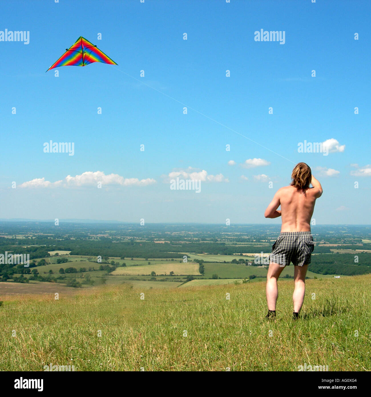 Man flying a kite Stock Photo - Alamy