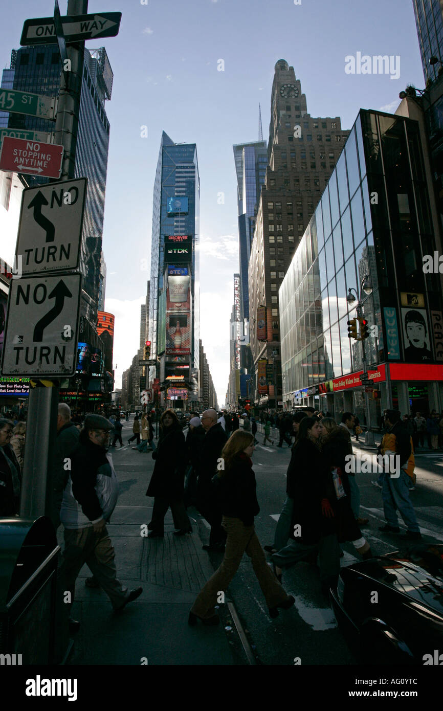 pedestrians walking across crosswalk times square in daytime new york ...
