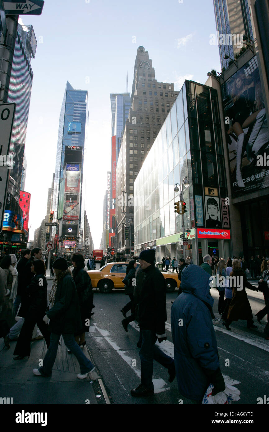 pedestrians walking across crosswalk times square in daytime new york ...