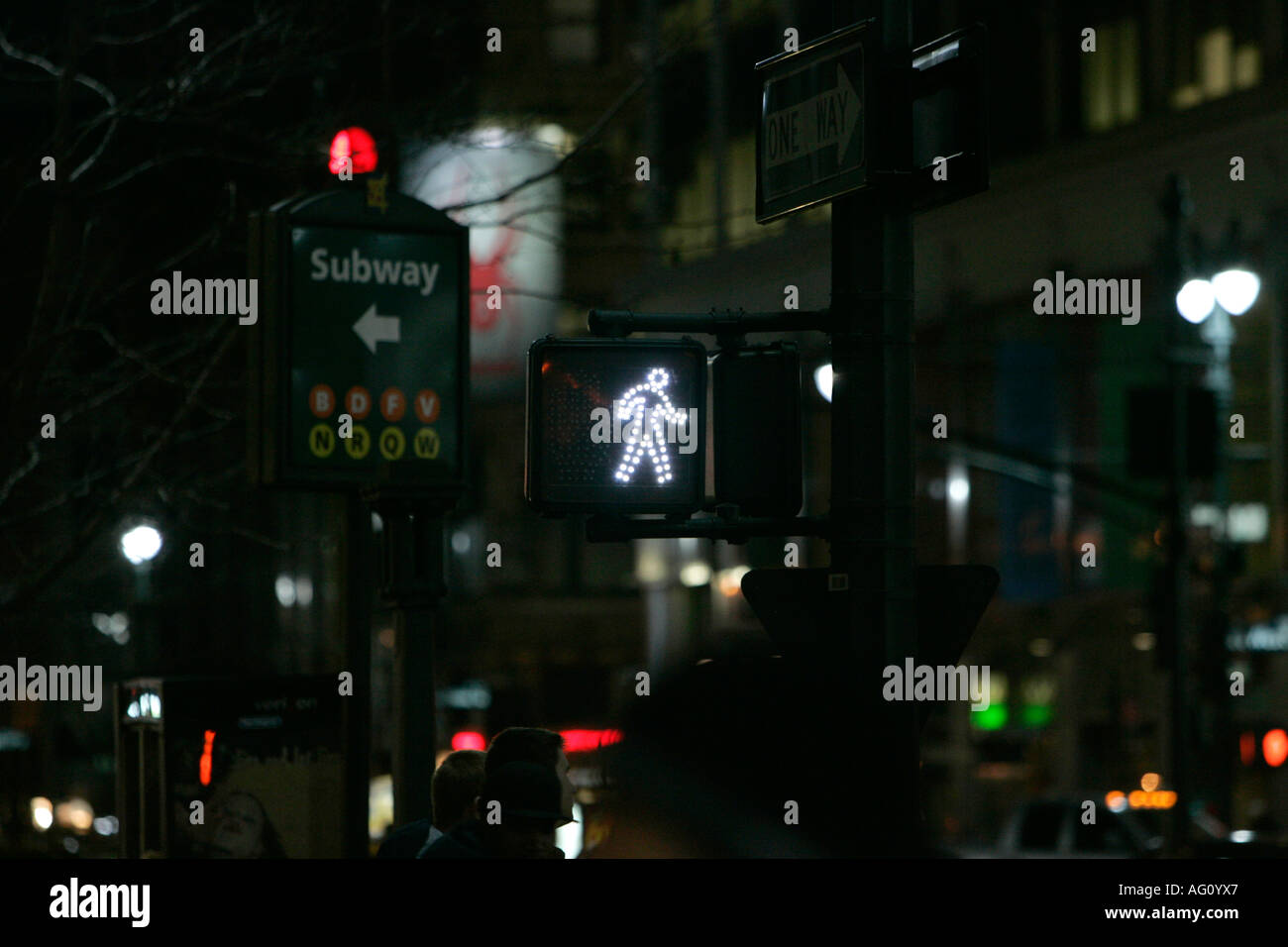 white man pedestrian walk sign illuminated at night in street scene new ...