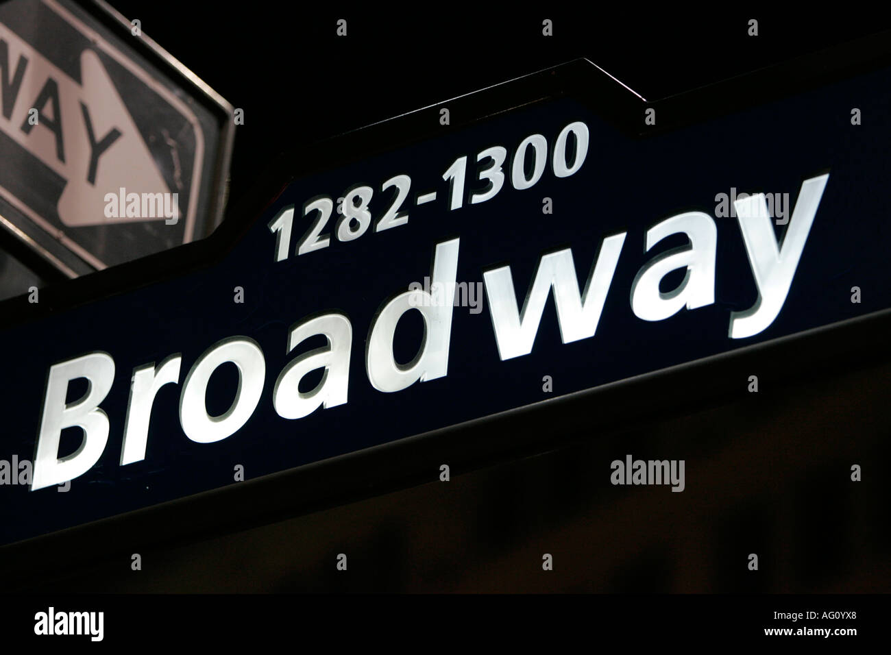 Broadway illuminated street sign at night new york city new york USA ...
