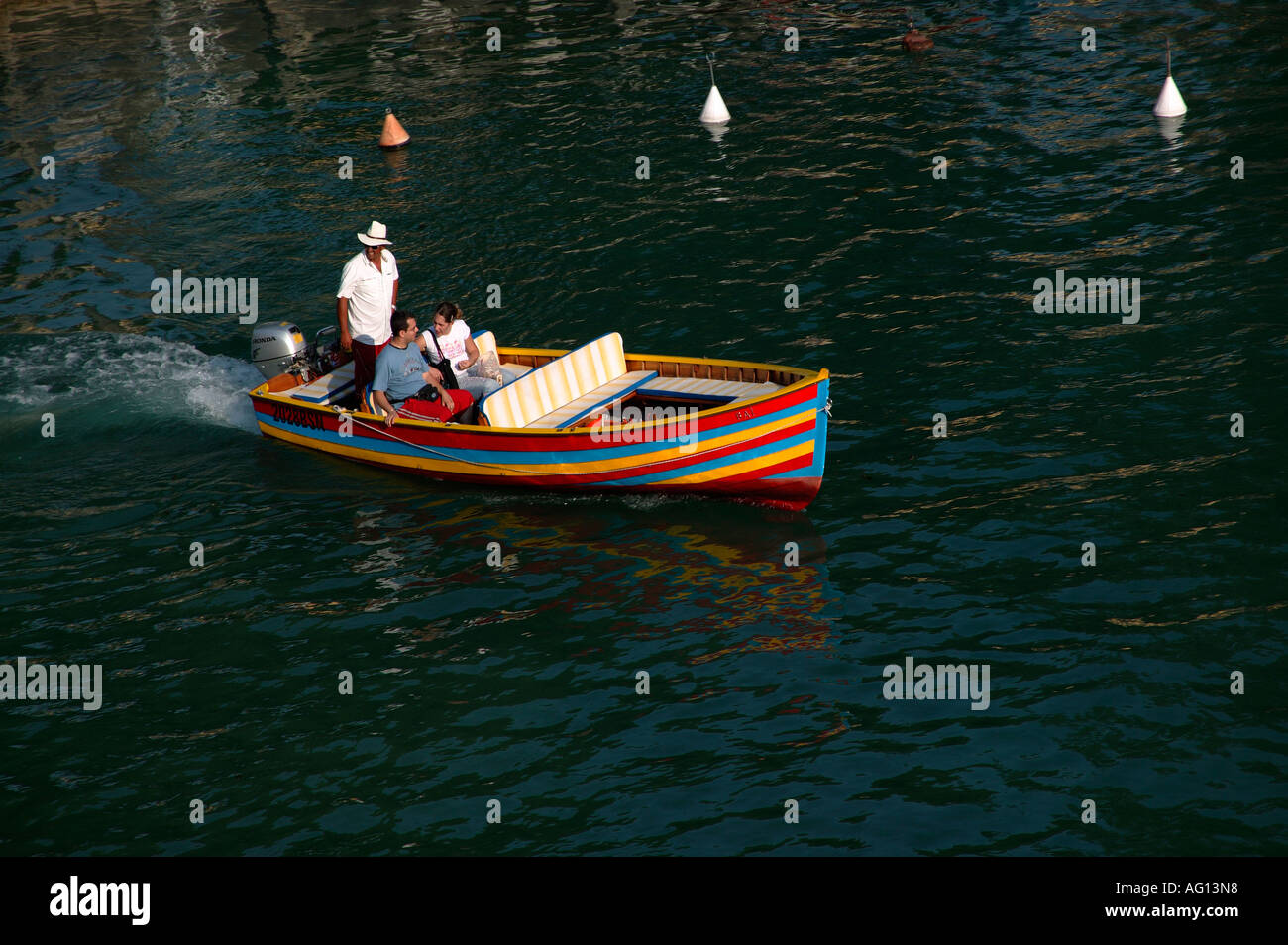 Colourful Tourist boat with guide, man and woman on board, Lake Garda ...