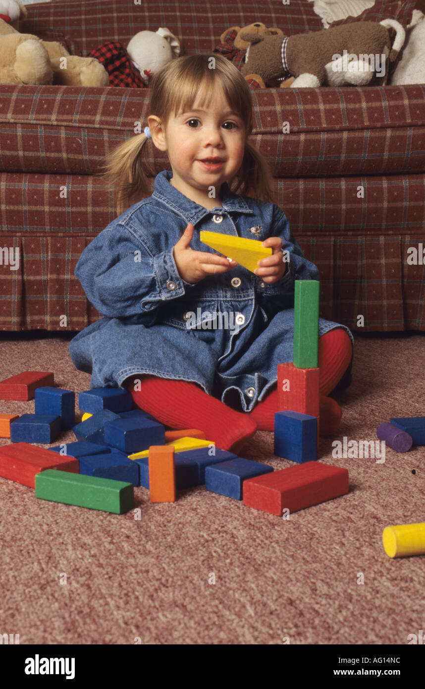 Little girl with building blocks Stock Photo - Alamy