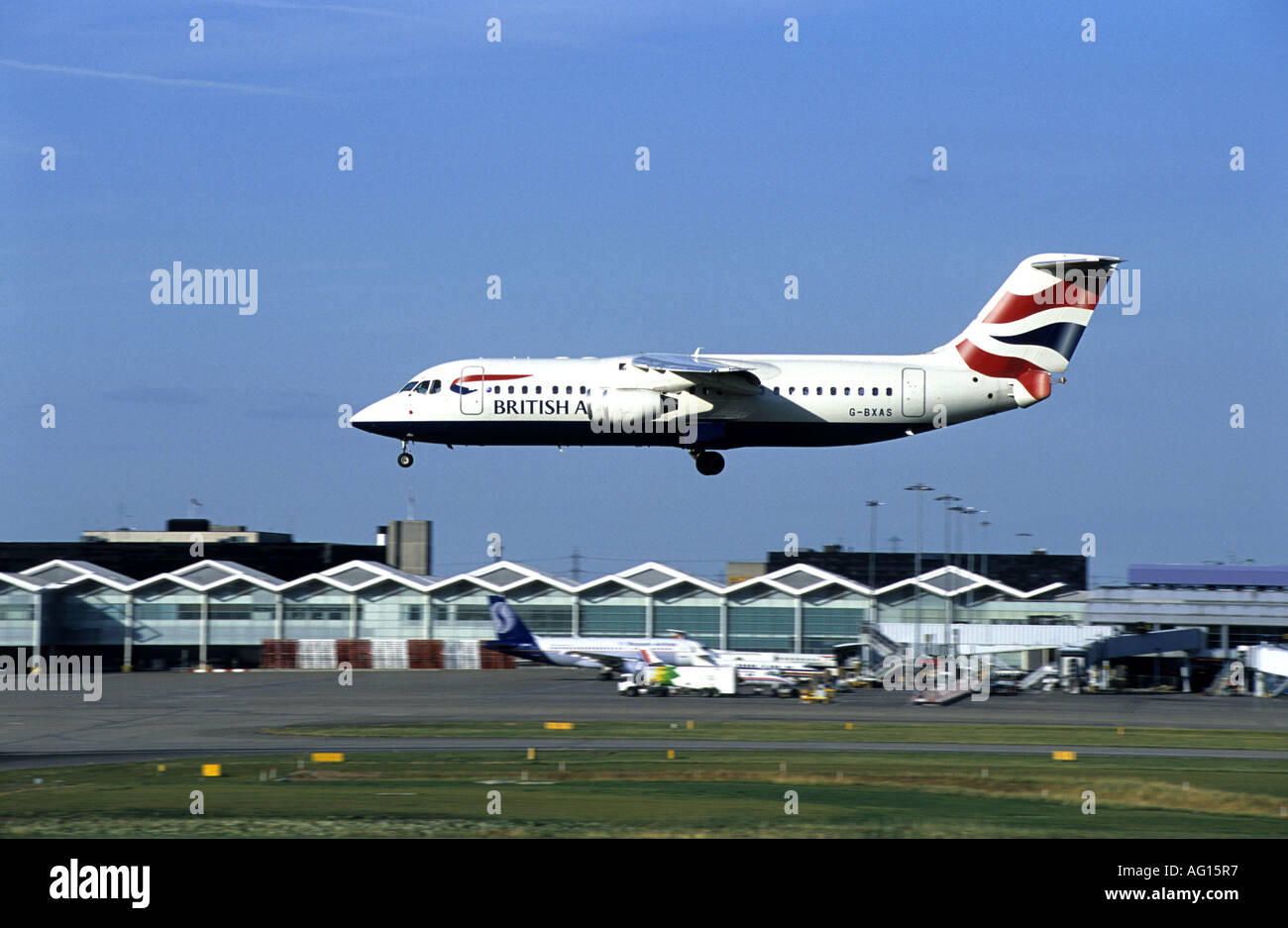 British Airways Avro RJ100 aircraft landing at Birmingham International ...