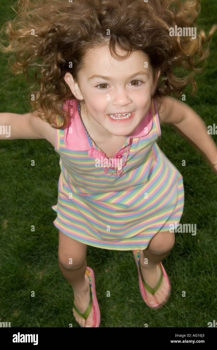 Young Girl Jumping Up Stock Photo - Alamy