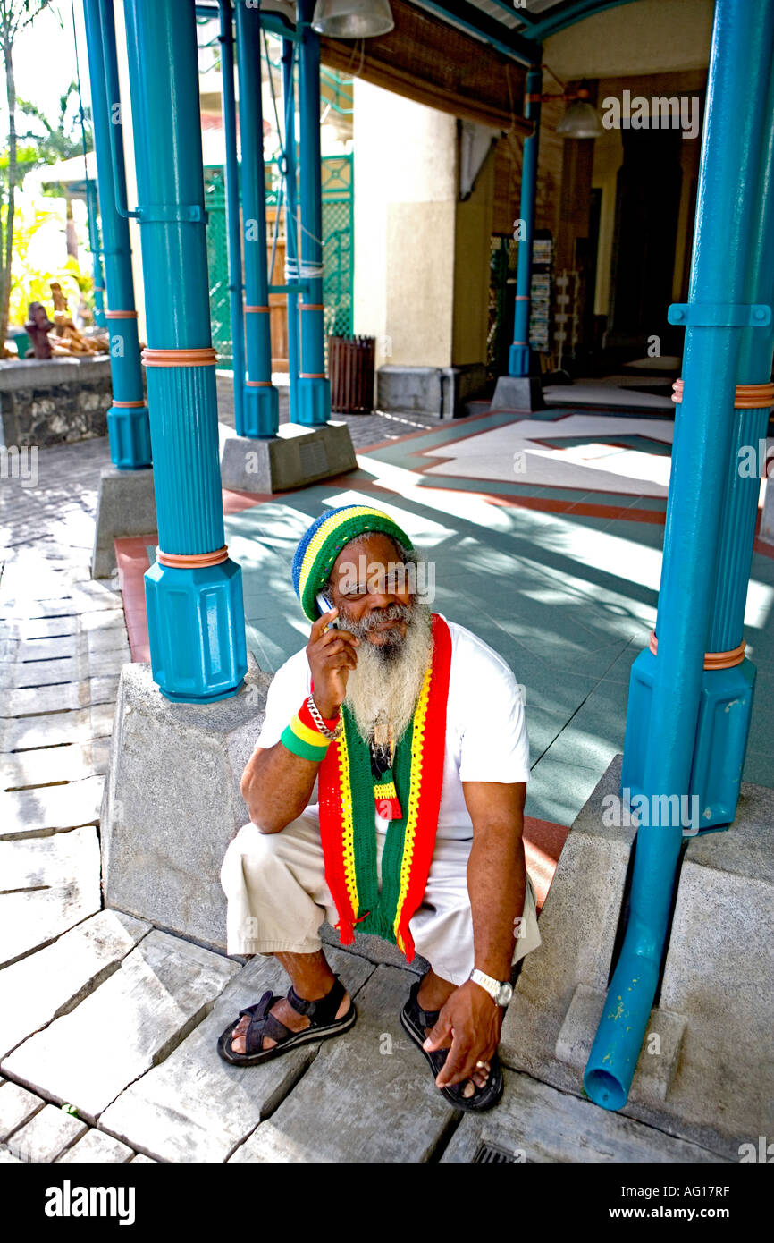 Local Character artist on mobile phone - Caudan, Mauritius Stock Photo ...