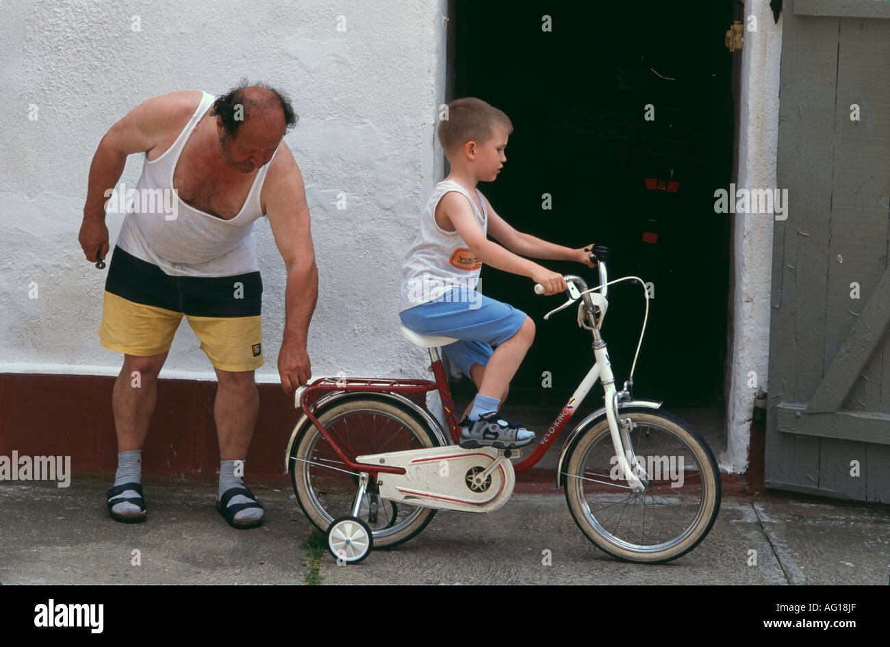 Learning to ride a bicycle Stock Photo - Alamy
