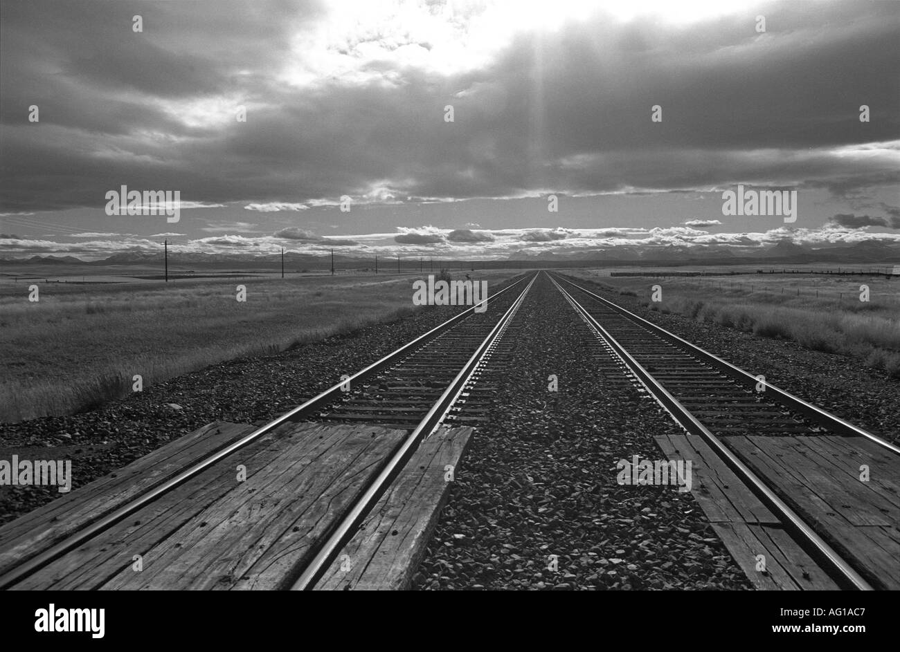 Railroad tracks disappear into the sunset in northern Montana, USA Stock Photo - Alamy