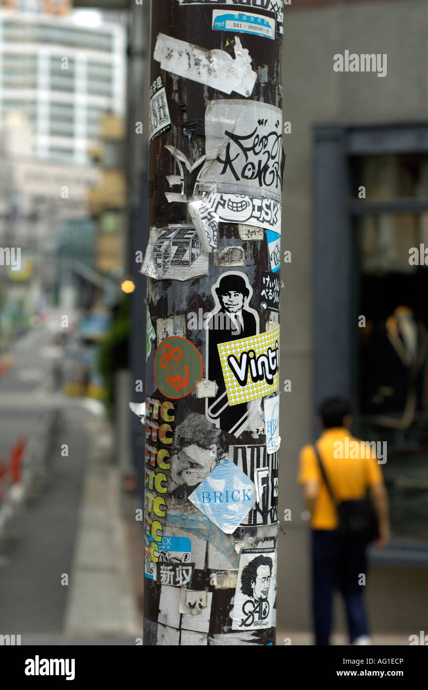 Street lantern marked with graffiti and stickers Stock Photo - Alamy