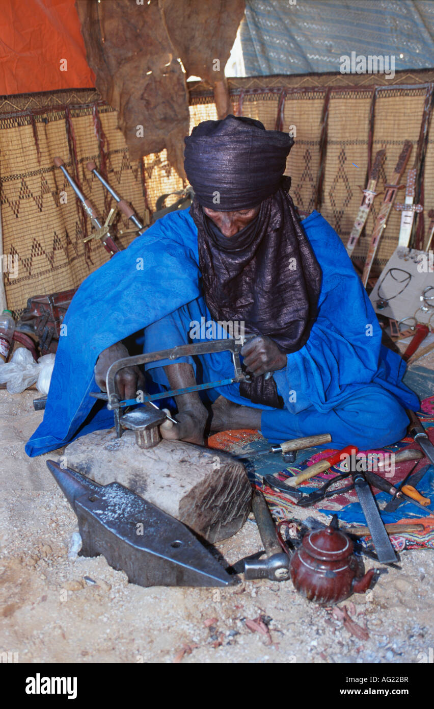 Algeria Djanet Man of Tuareg tribe working with tools as smith Stock ...
