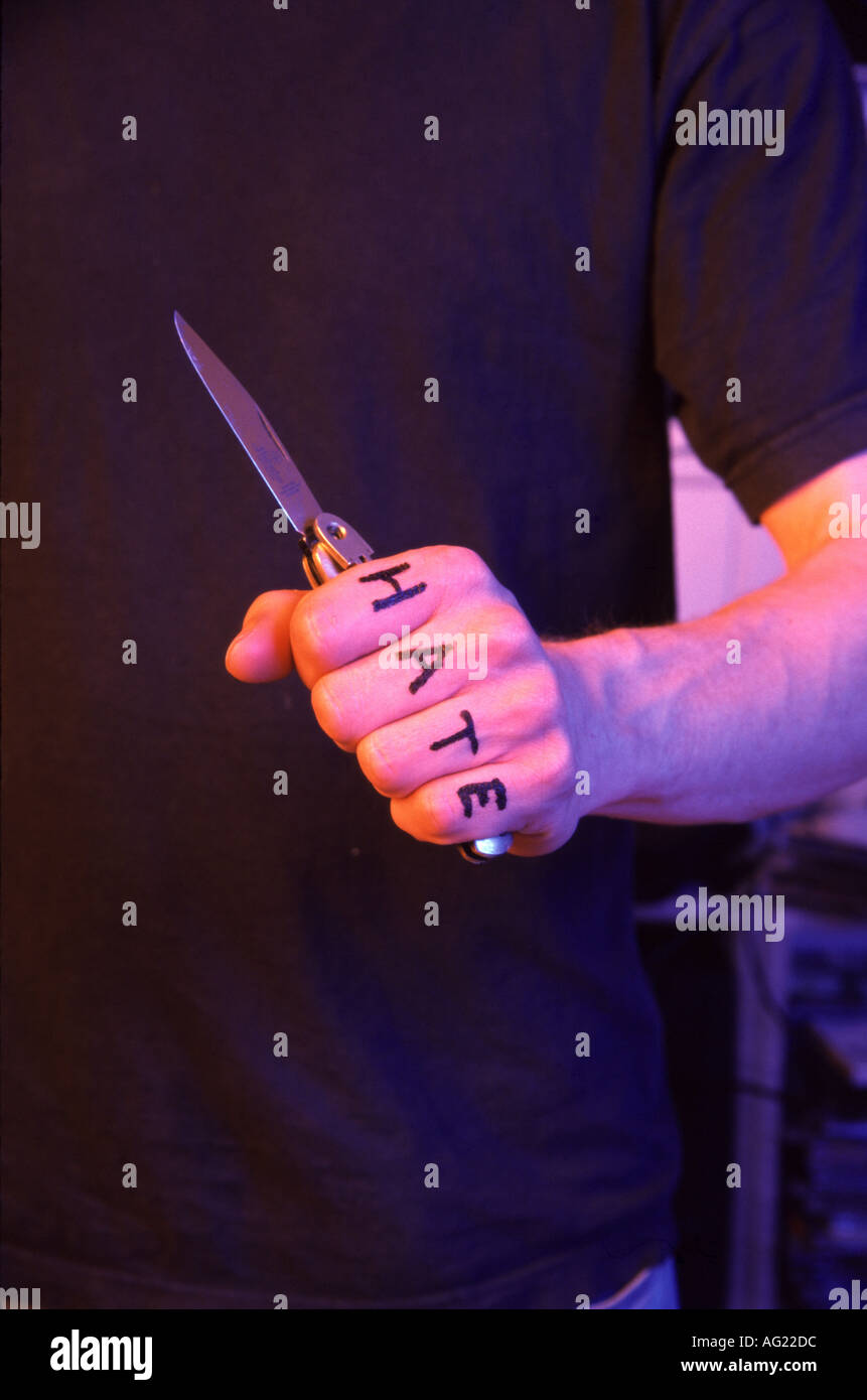 Hand holding a knife Stock Photo - Alamy