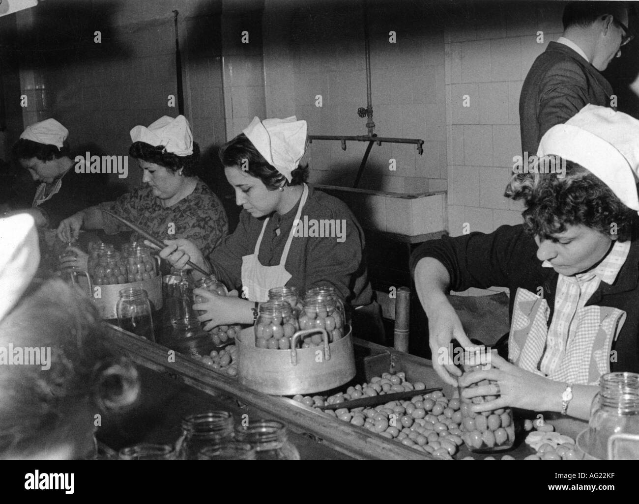industry, food, olives, filling the olives in glasses, Spain, 1960s ...