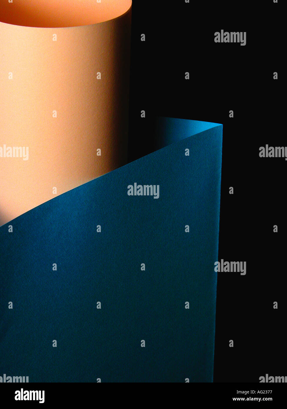 Blue and orange folded paper cylinder within a triangular prism Stock ...