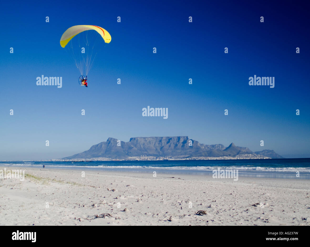 On a bright sunny windless winter s day a motorized hanglider takes to ...