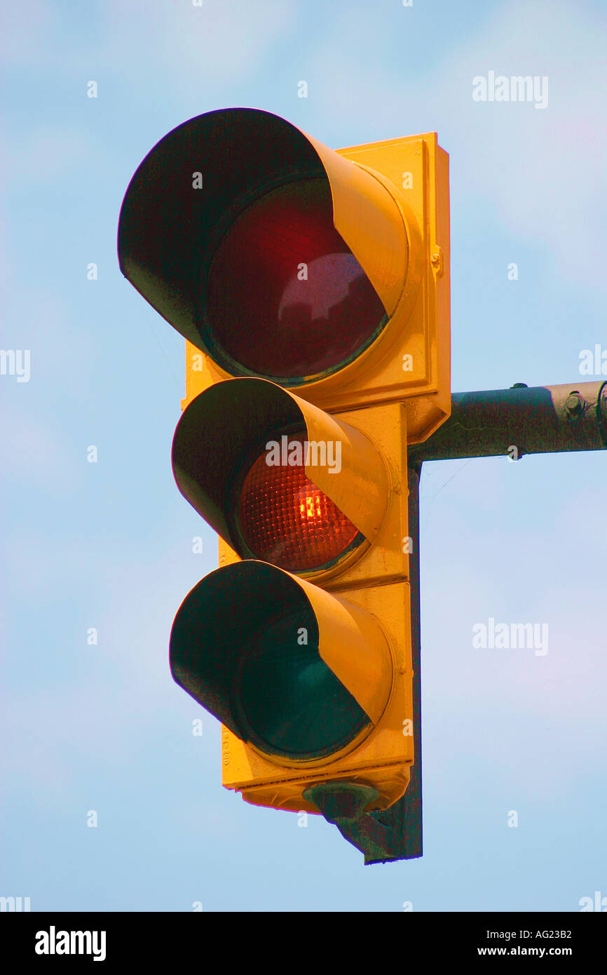 Amber traffic light against a blue sky Stock Photo - Alamy