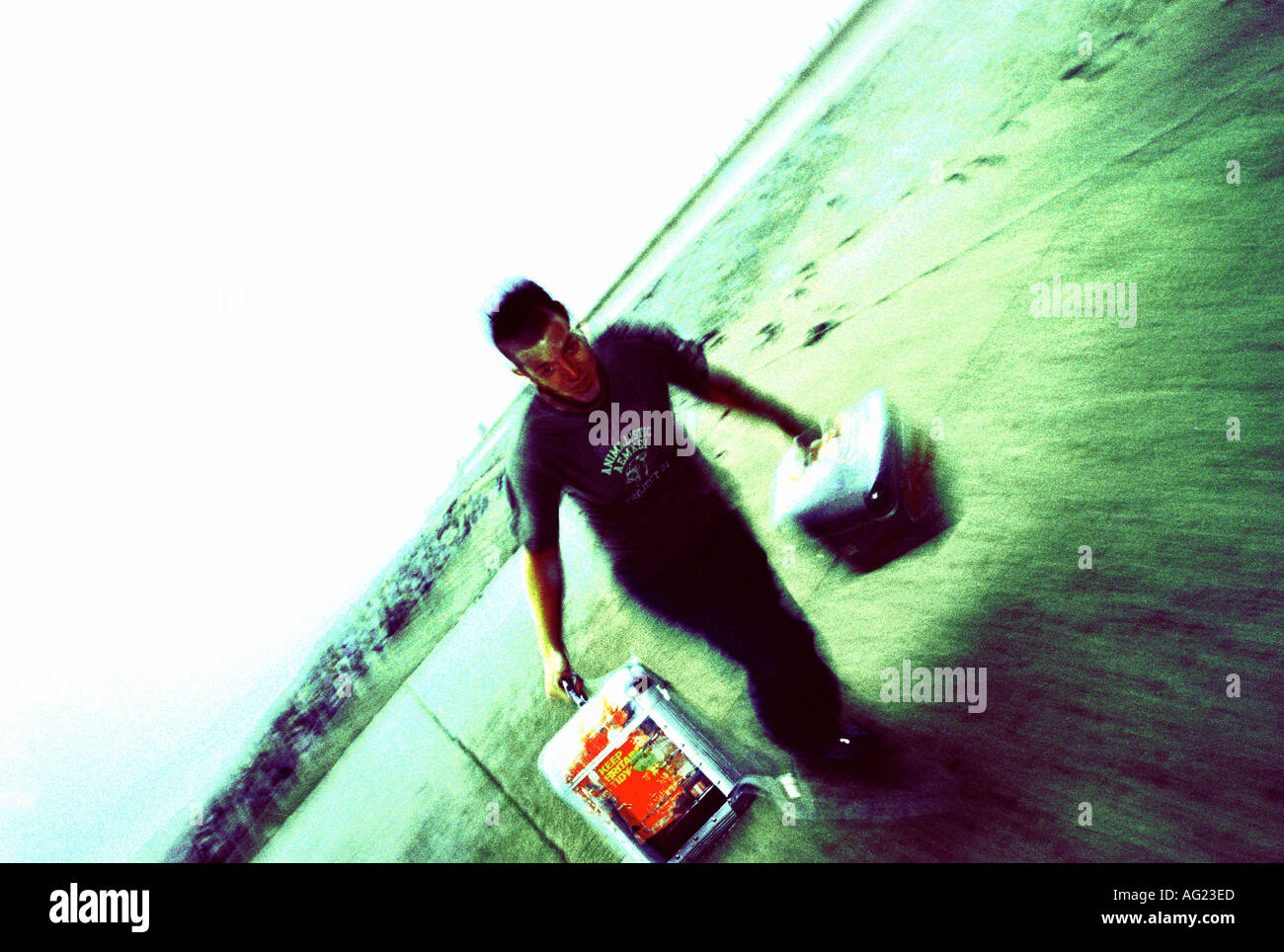 DJ running with record boxes Stock Photo - Alamy