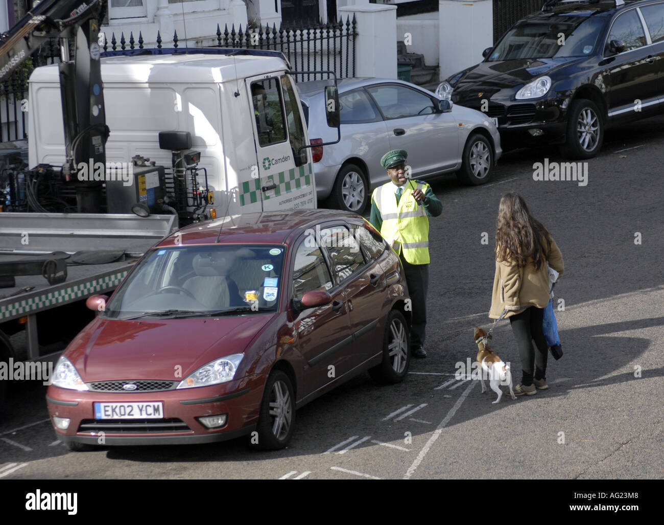 Woman remonstrating with a traffic parking warden in Camden London ...