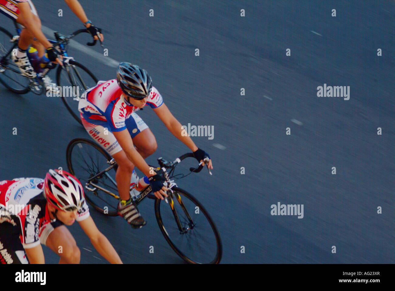 3 cyclists participating in a road race Stock Photo - Alamy