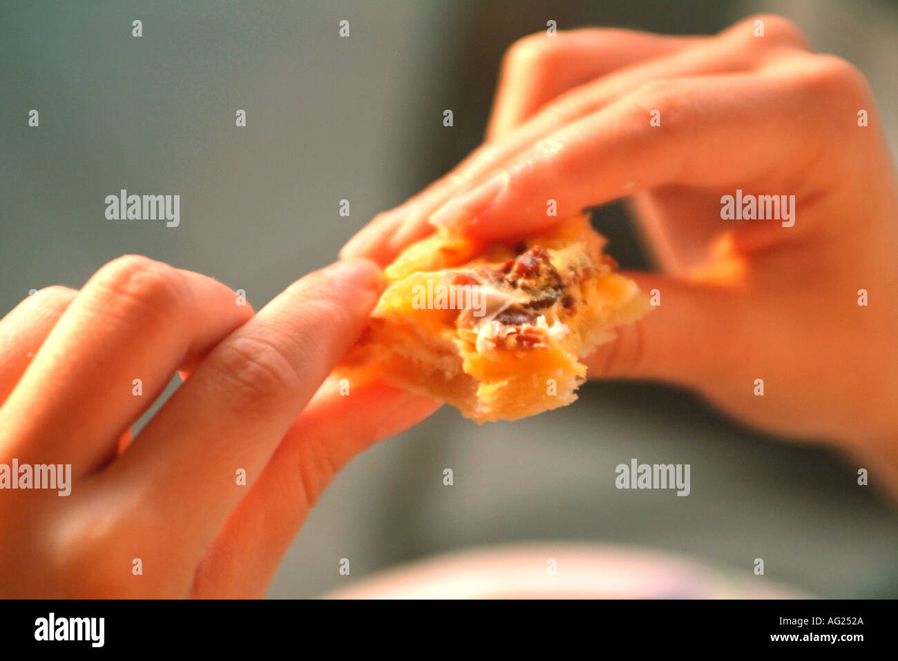 Fingers holding food to eat Stock Photo - Alamy