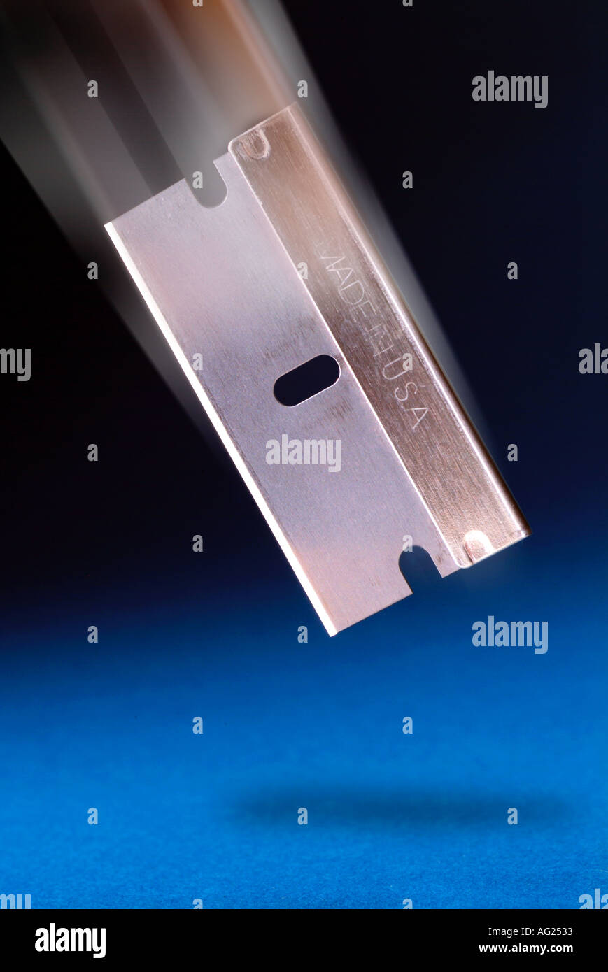 Single edge razor blade in motion Stock Photo - Alamy
