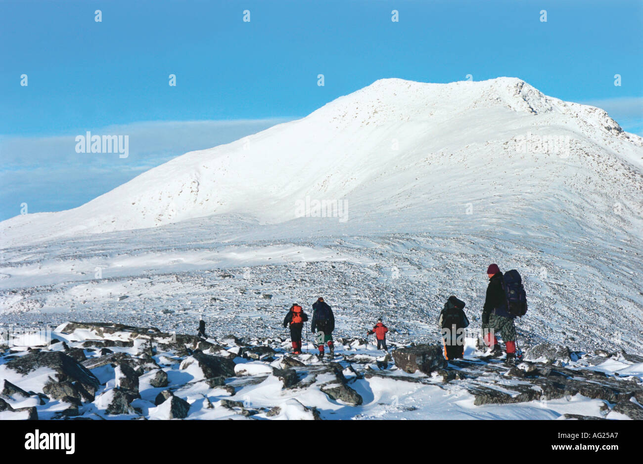 Group of tourists is mounting to the highest peak of the Urals the ...