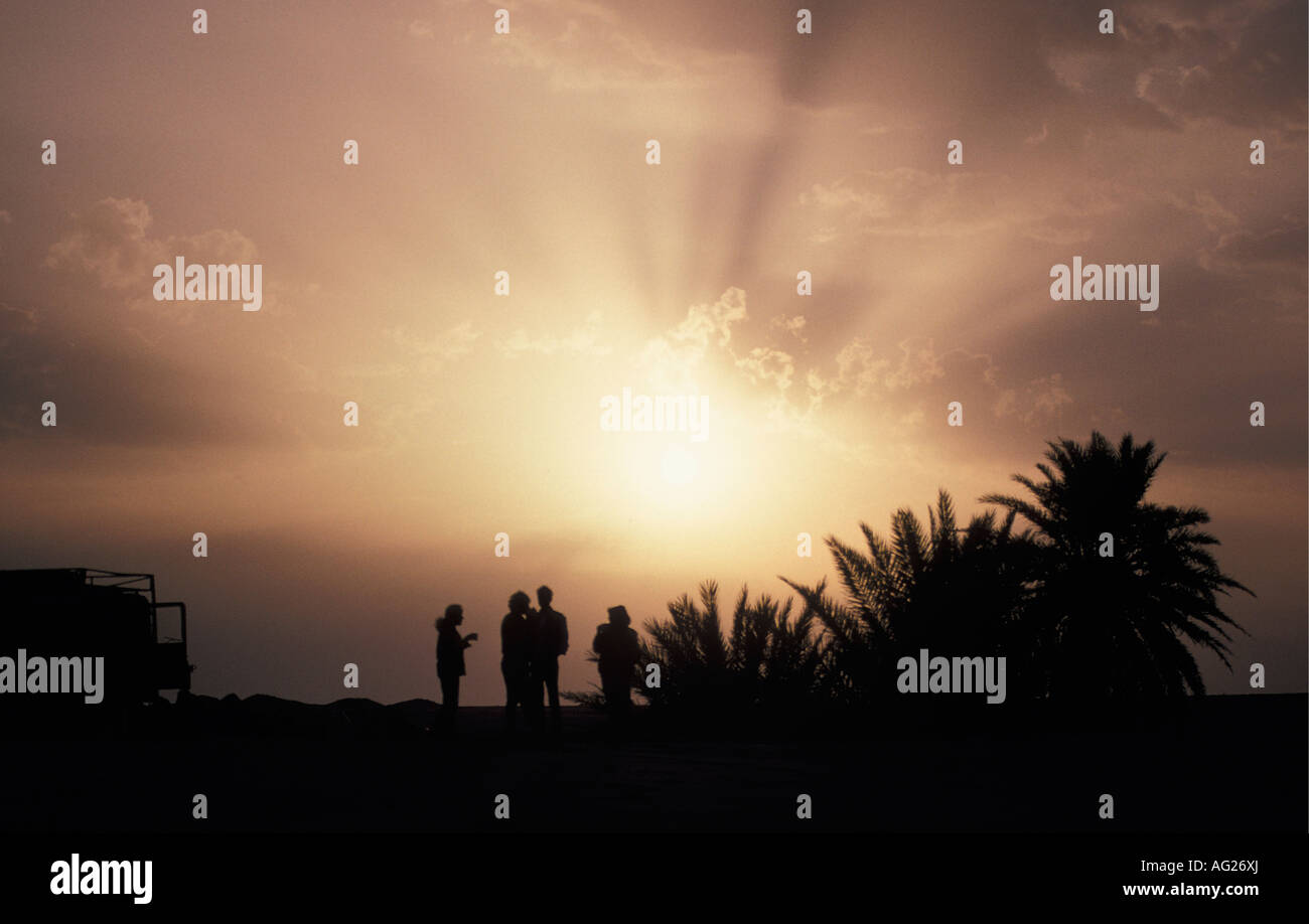 Algeria Timimoun Tourists chatting in Sahara desert at sunset Stock ...