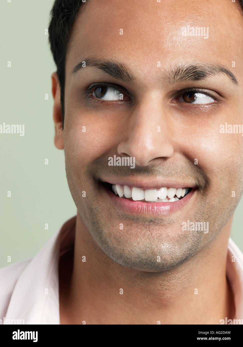 Mid adult man looking away and smiling, close-up Stock Photo - Alamy