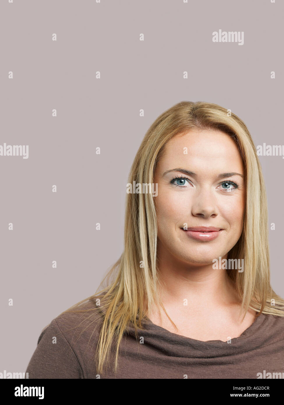 Mid adult woman smiling Stock Photo - Alamy