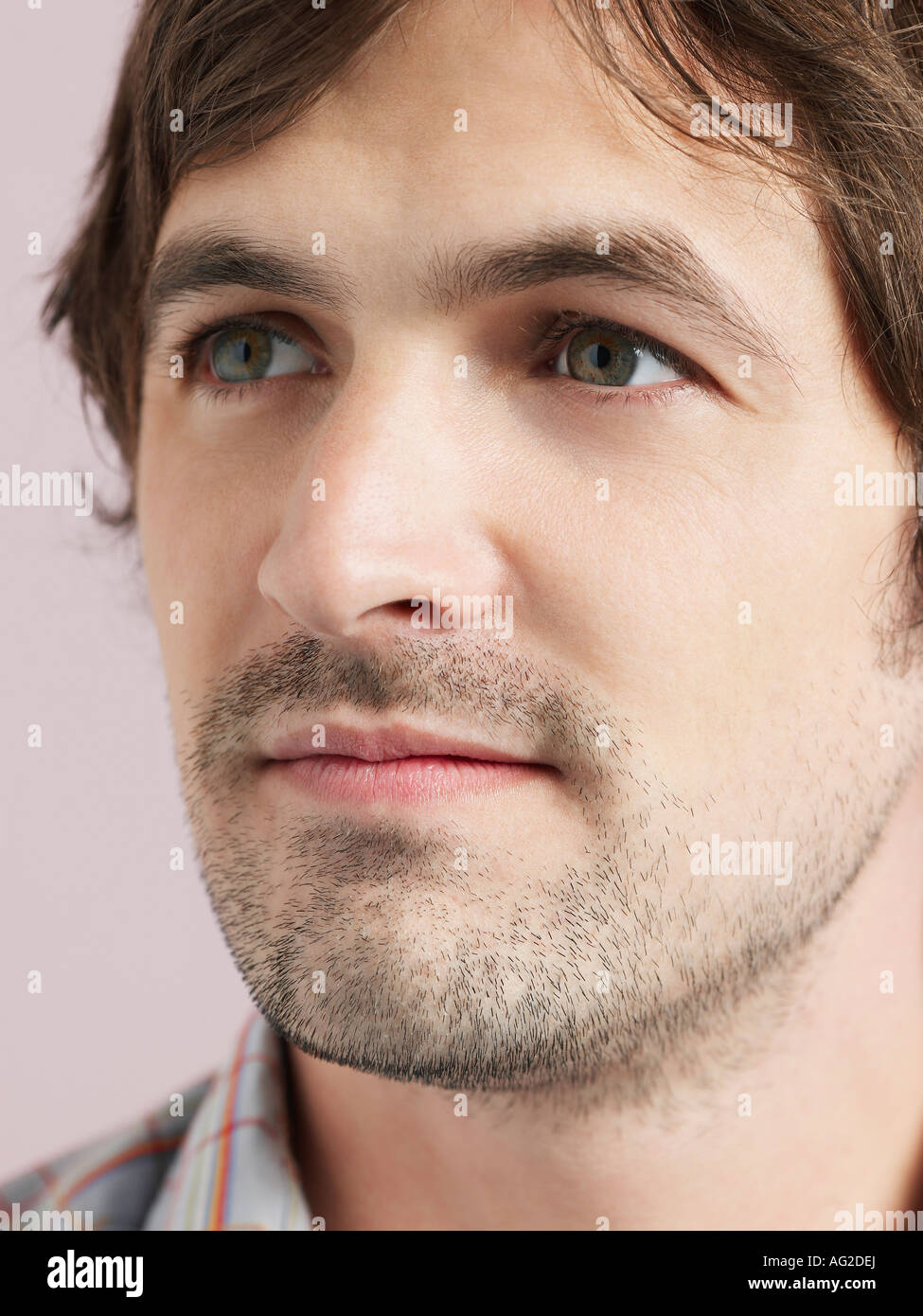 Mid adult man looking away, close-up of face Stock Photo - Alamy
