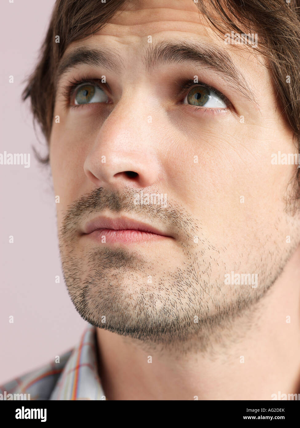 Mid adult man looking up, close-up of face Stock Photo - Alamy