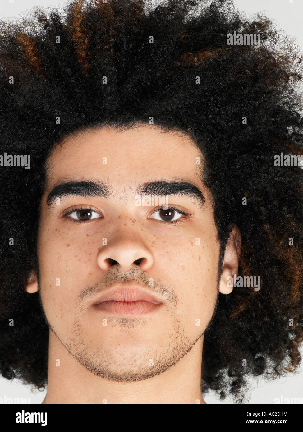 Young man with afro, close-up Stock Photo - Alamy