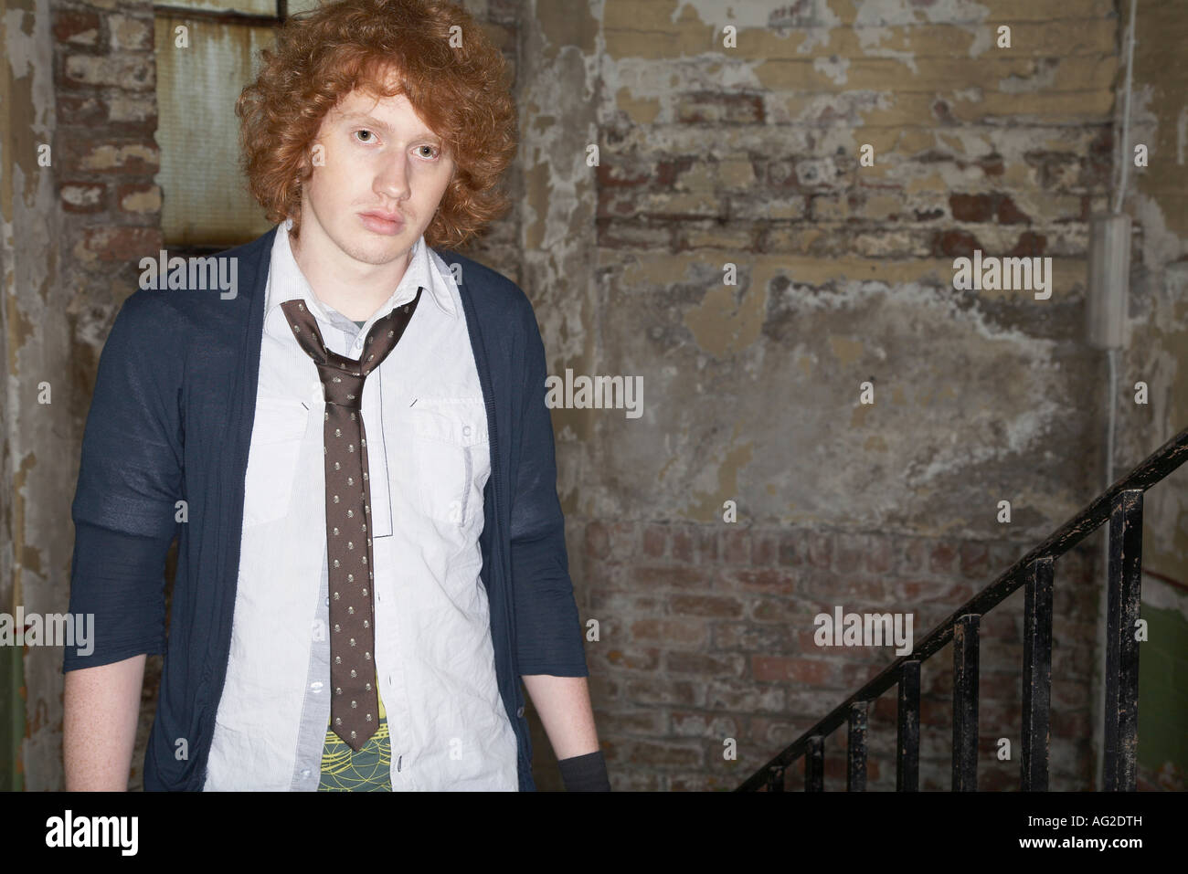 Young man outside old building Stock Photo - Alamy