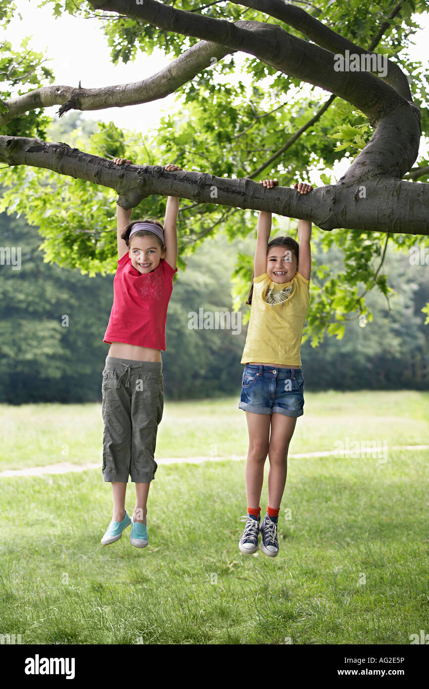 Girls hanging from tree hi-res stock photography and images - Alamy