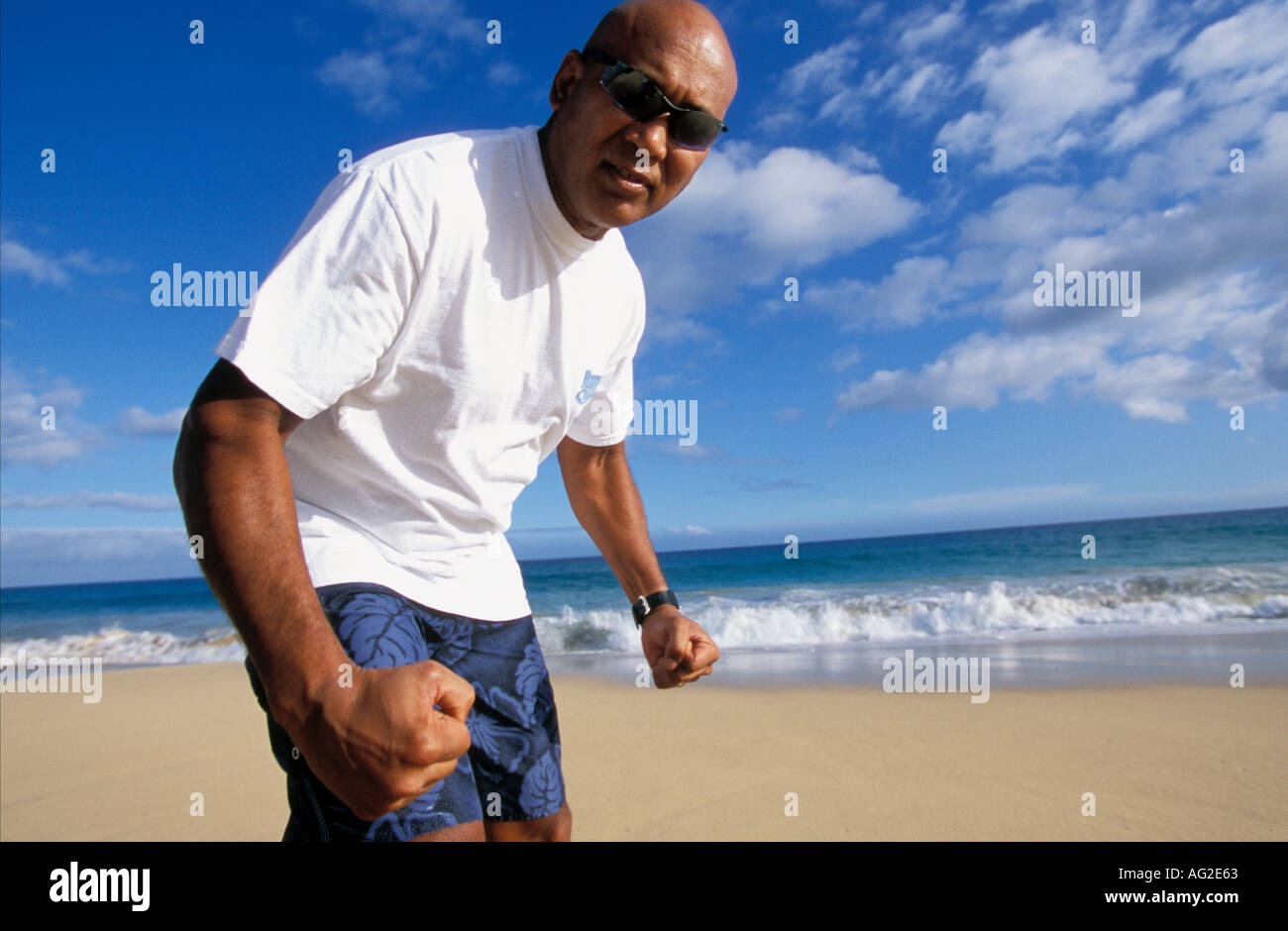 Hawaiian man on beach, Kauai, Hawaii Stock Photo - Alamy