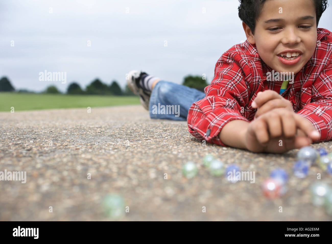 Boy playing marbles hi-res stock photography and images - Alamy