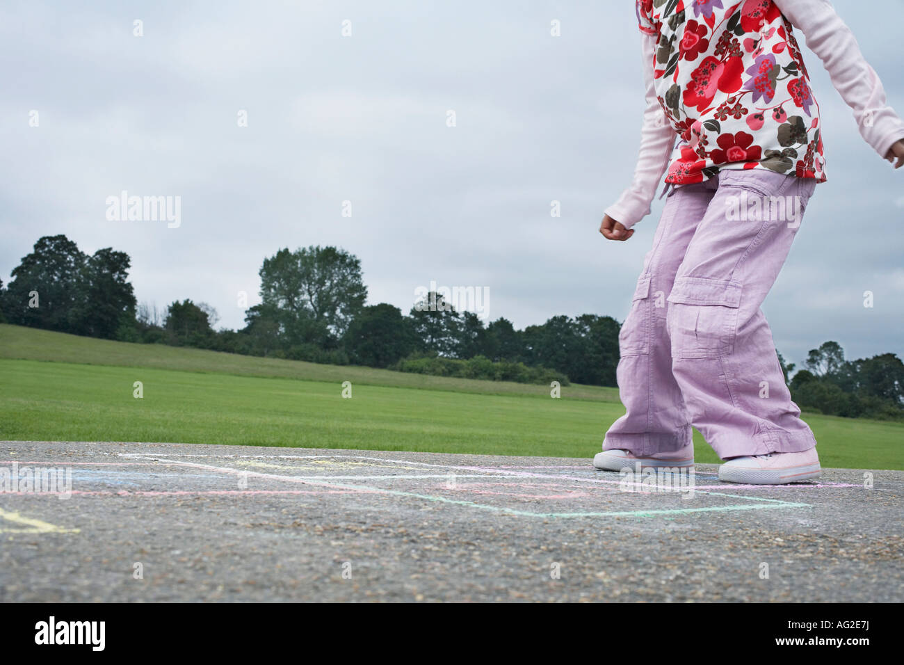 Girl (7-9) playing hop-scotch in school playground, low section Stock ...